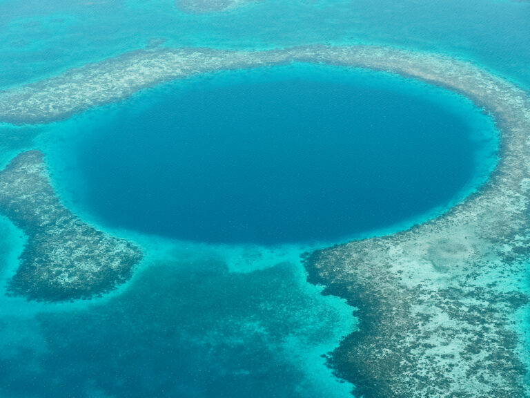 Exactly How to Fly Over the Blue Hole Belize
