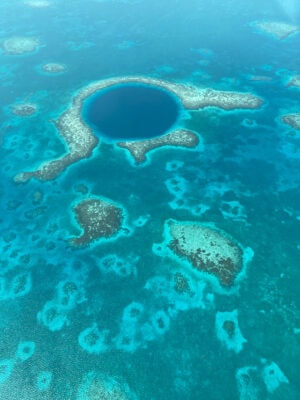 Exactly How to Fly Over the Blue Hole Belize